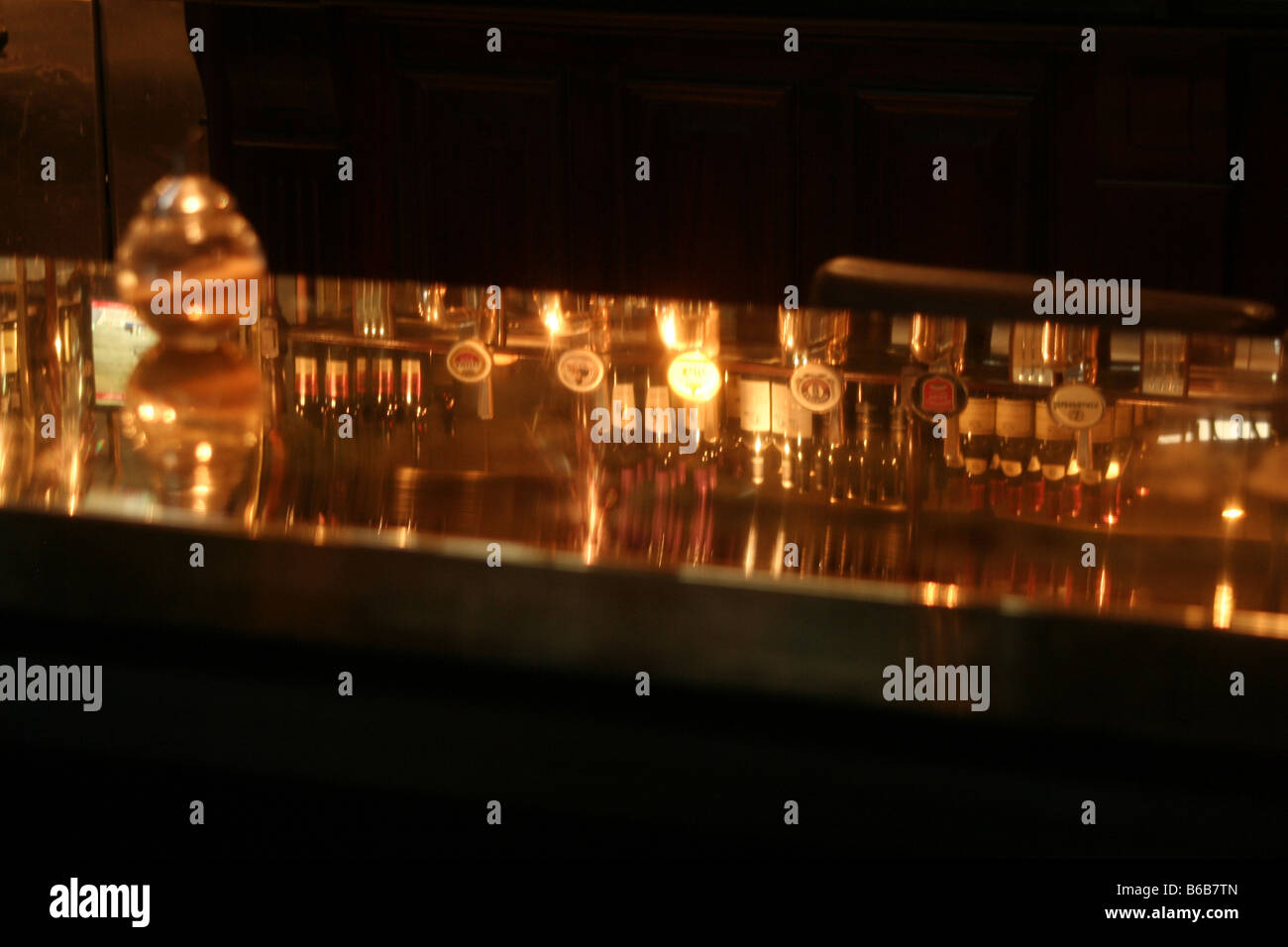 the reflection of a bar on a shiny surface in a cafe, windsor ...