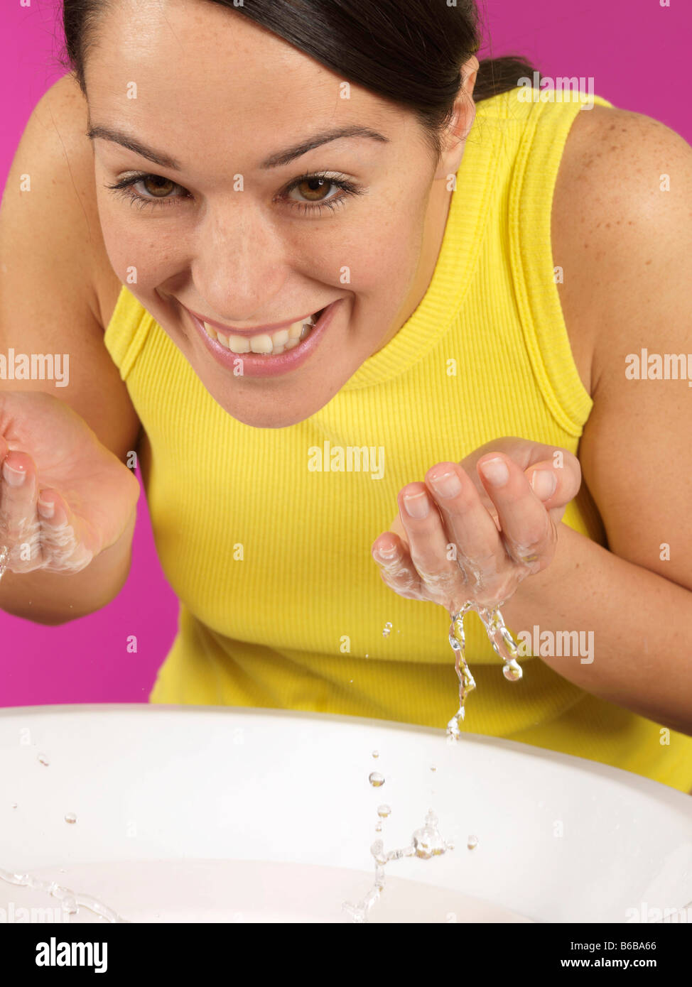 Young Woman Washing Face Model Released Stock Photo - Alamy