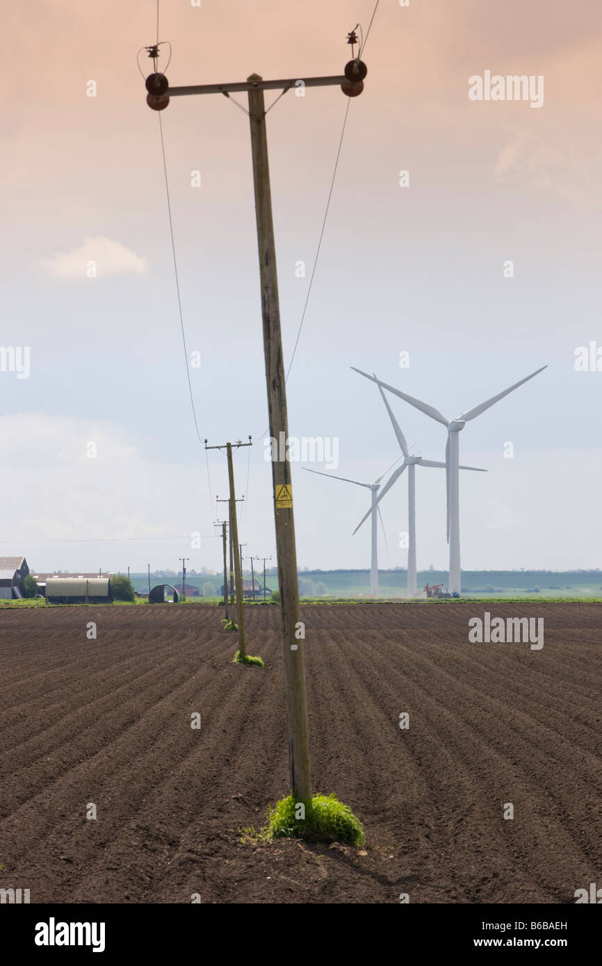 Wind turbines with leaning telegraph poles and powerlines Stock Photo ...