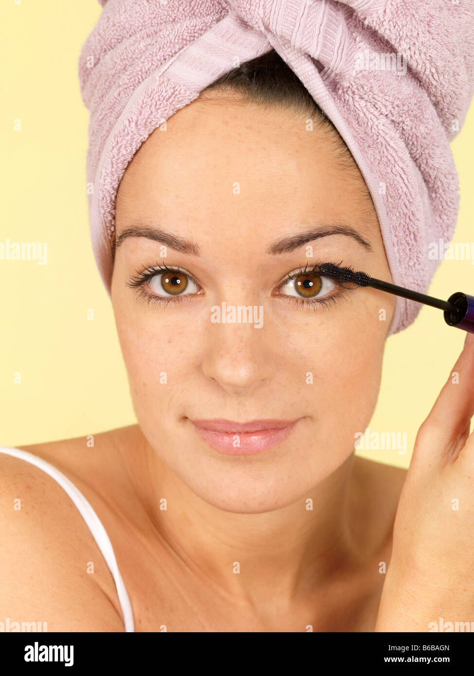 Young Woman Applying Mascara Model Released Stock Photo - Alamy