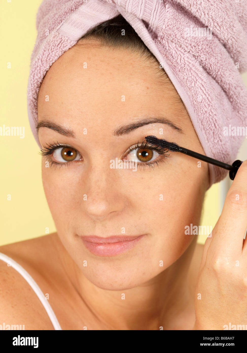 Young Woman Applying Mascara Model Released Stock Photo - Alamy