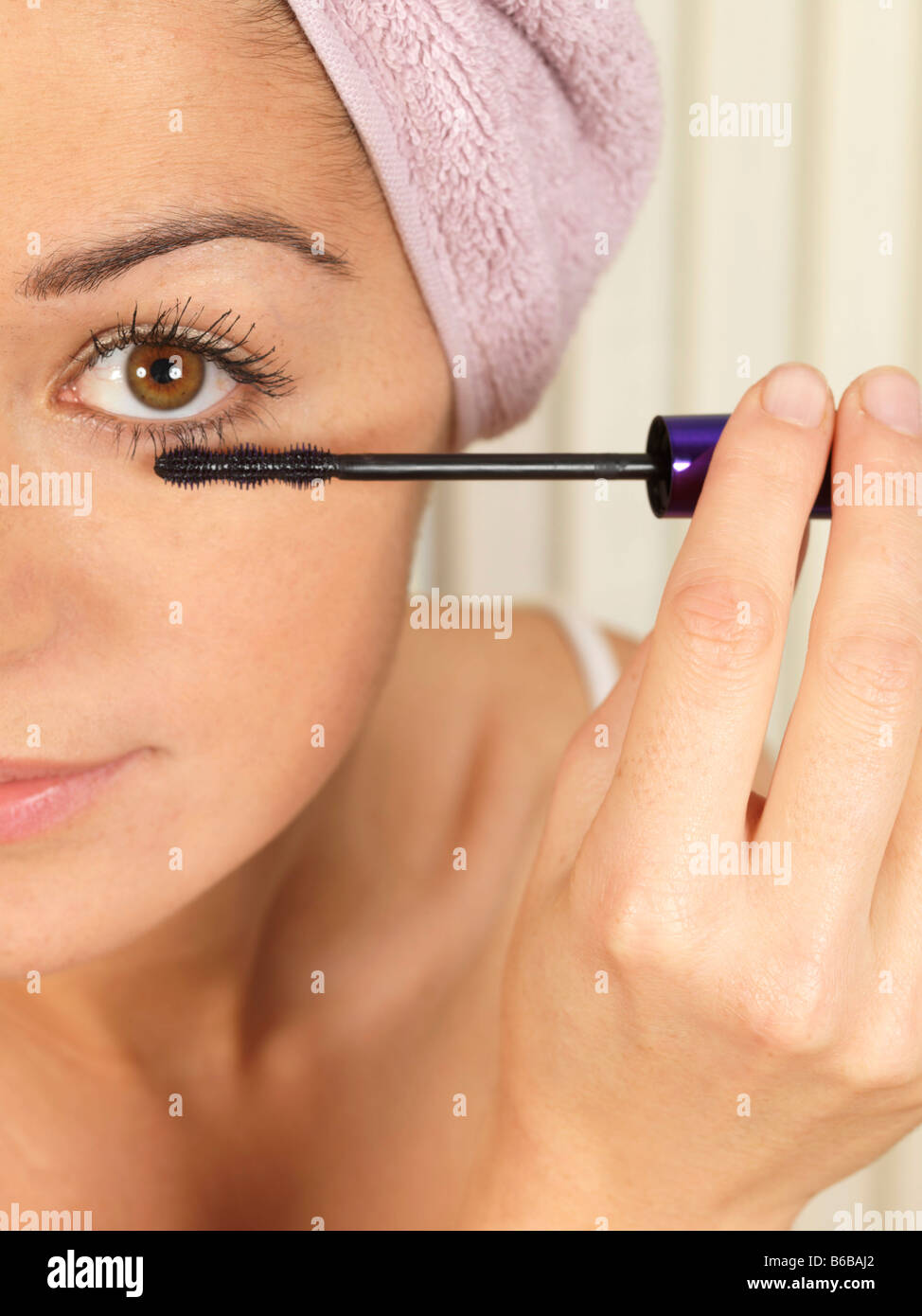 Young Woman Applying Mascara Model Released Stock Photo - Alamy