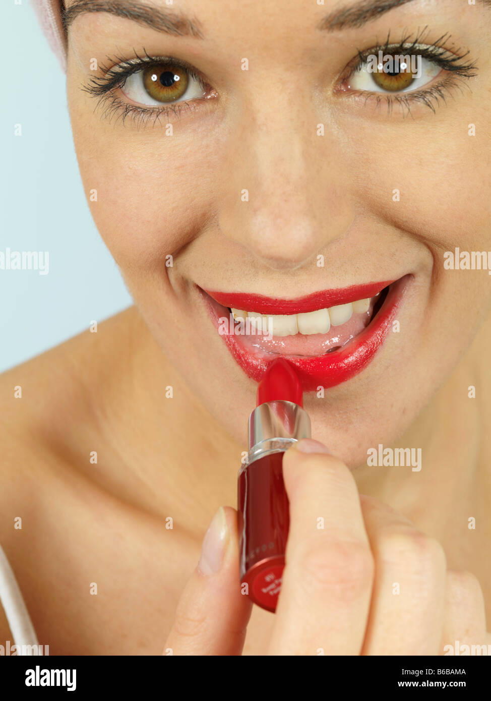 Young Woman Applying Red Lipstick Model Released Stock Photo - Alamy