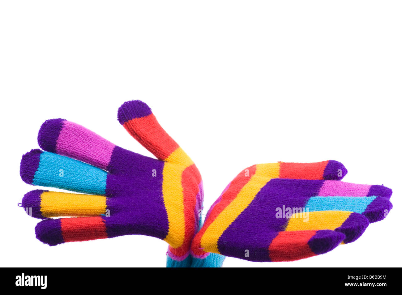 object on white clothes Colored glove Stock Photo - Alamy