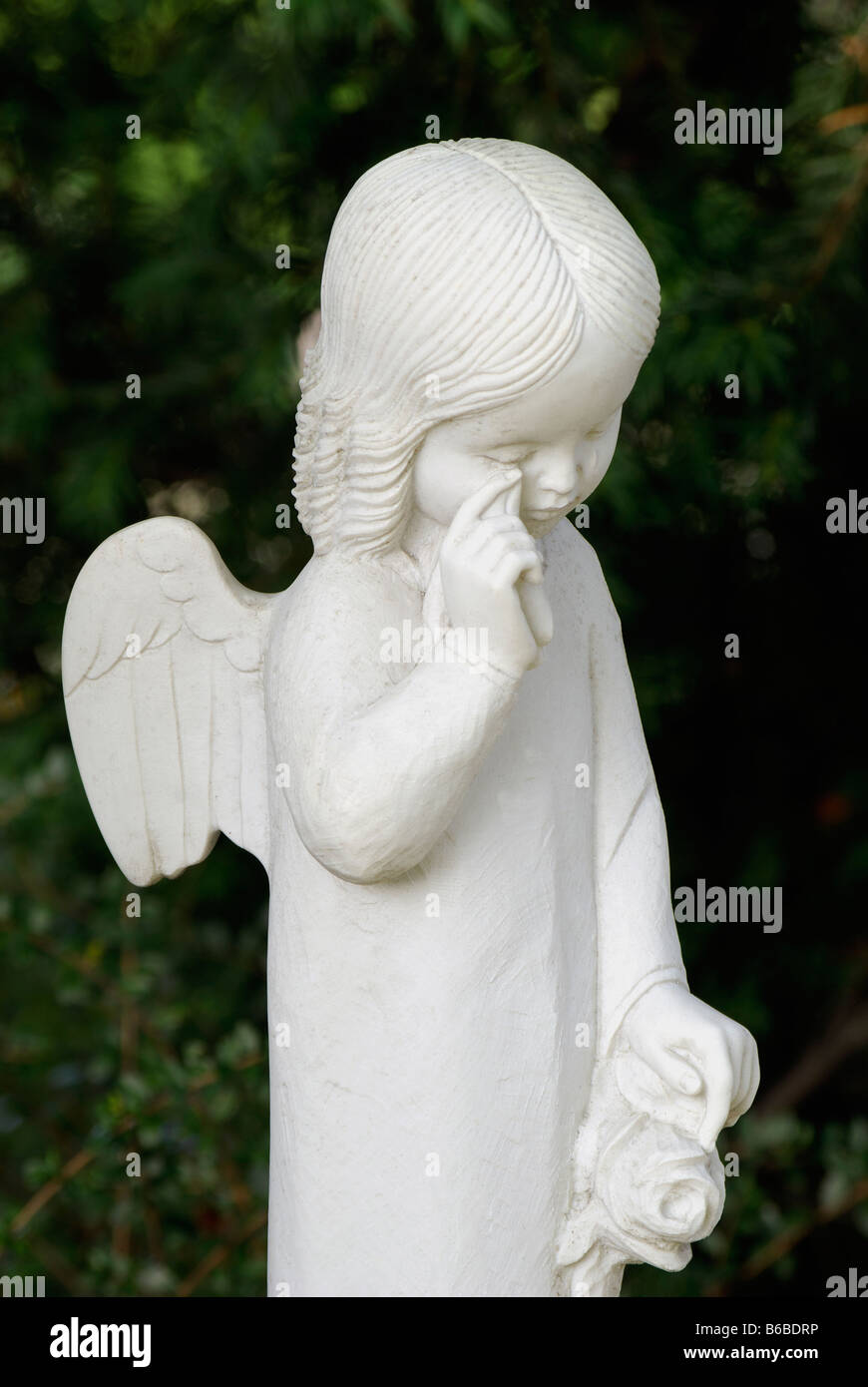angel sculpture statue girl weeping Stock Photo - Alamy