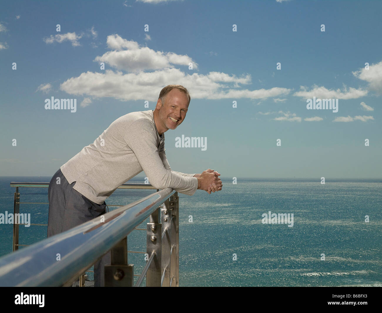 Man leaning on hand rail hi-res stock photography and images - Alamy