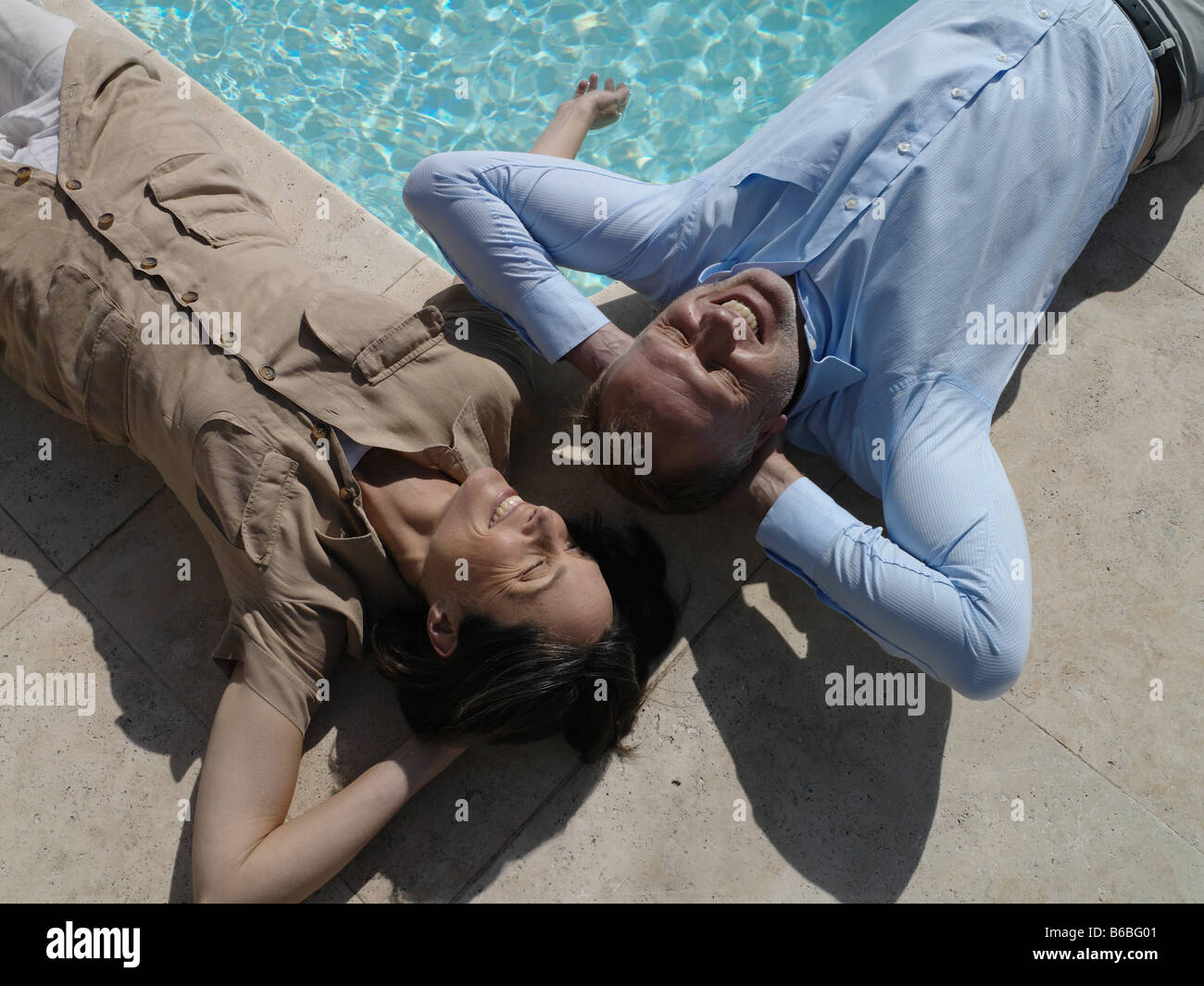 Woman lying on edge pool hi-res stock photography and images - Alamy