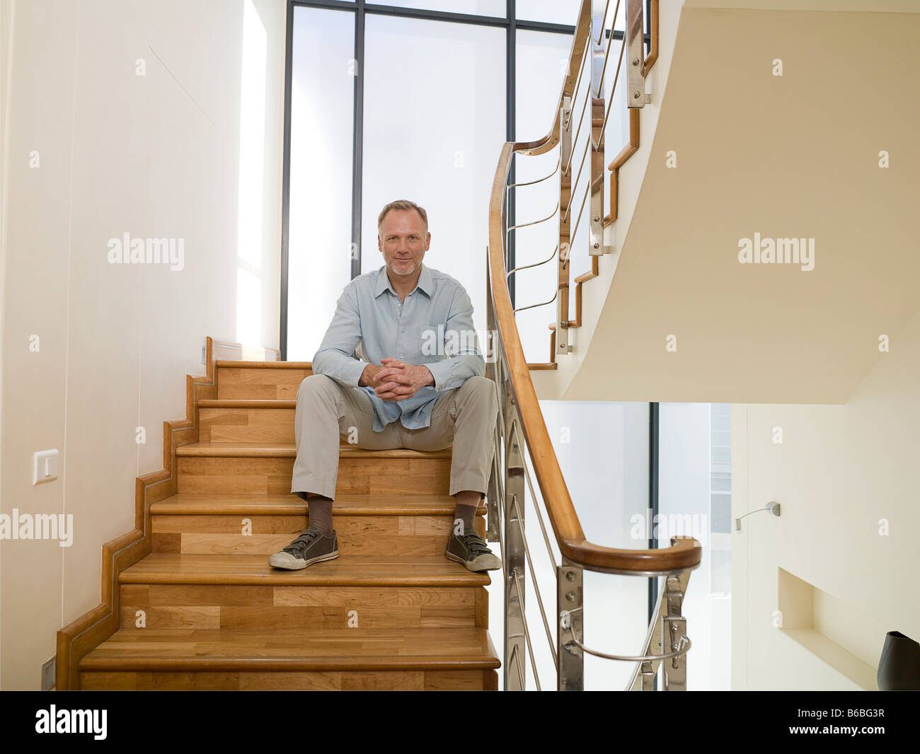 Sitting seated on steps stairs staircase hi-res stock photography and ...
