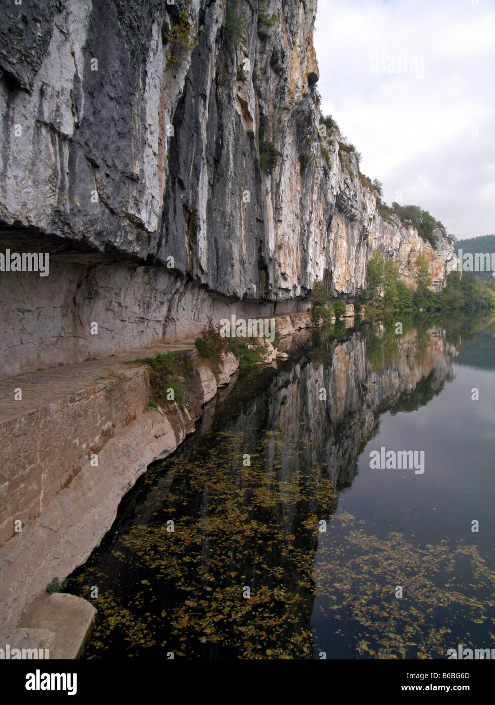 Reflection of cliff in water Stock Photo - Alamy