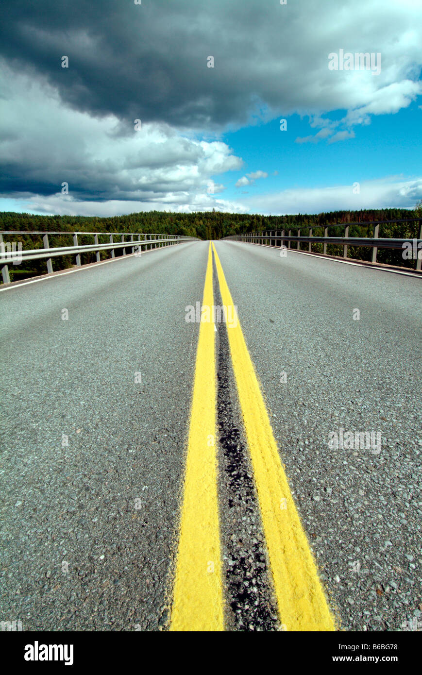 Road running through landscape Stock Photo - Alamy