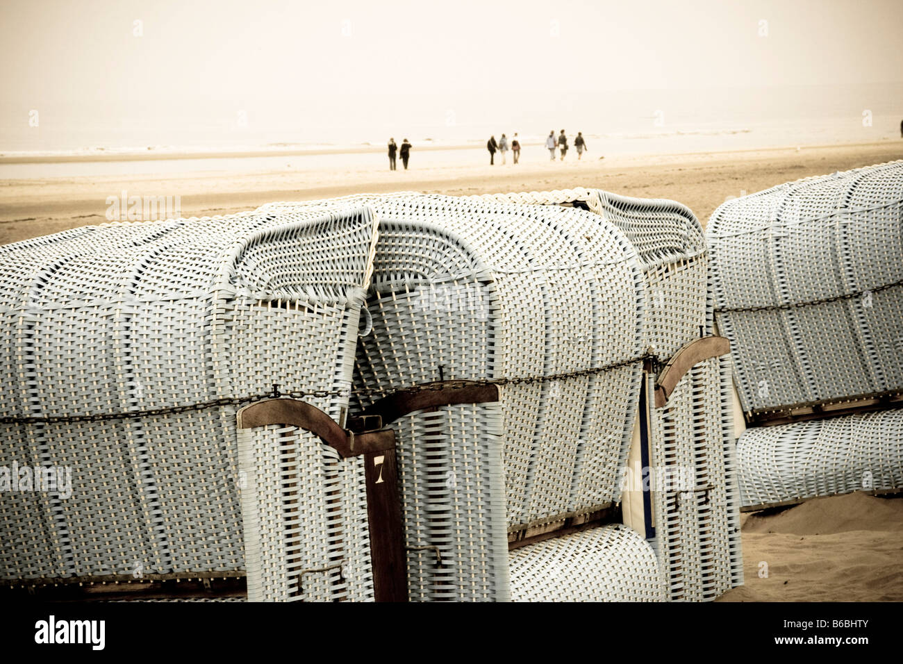 Wicker beach chairs on beach Stock Photo - Alamy