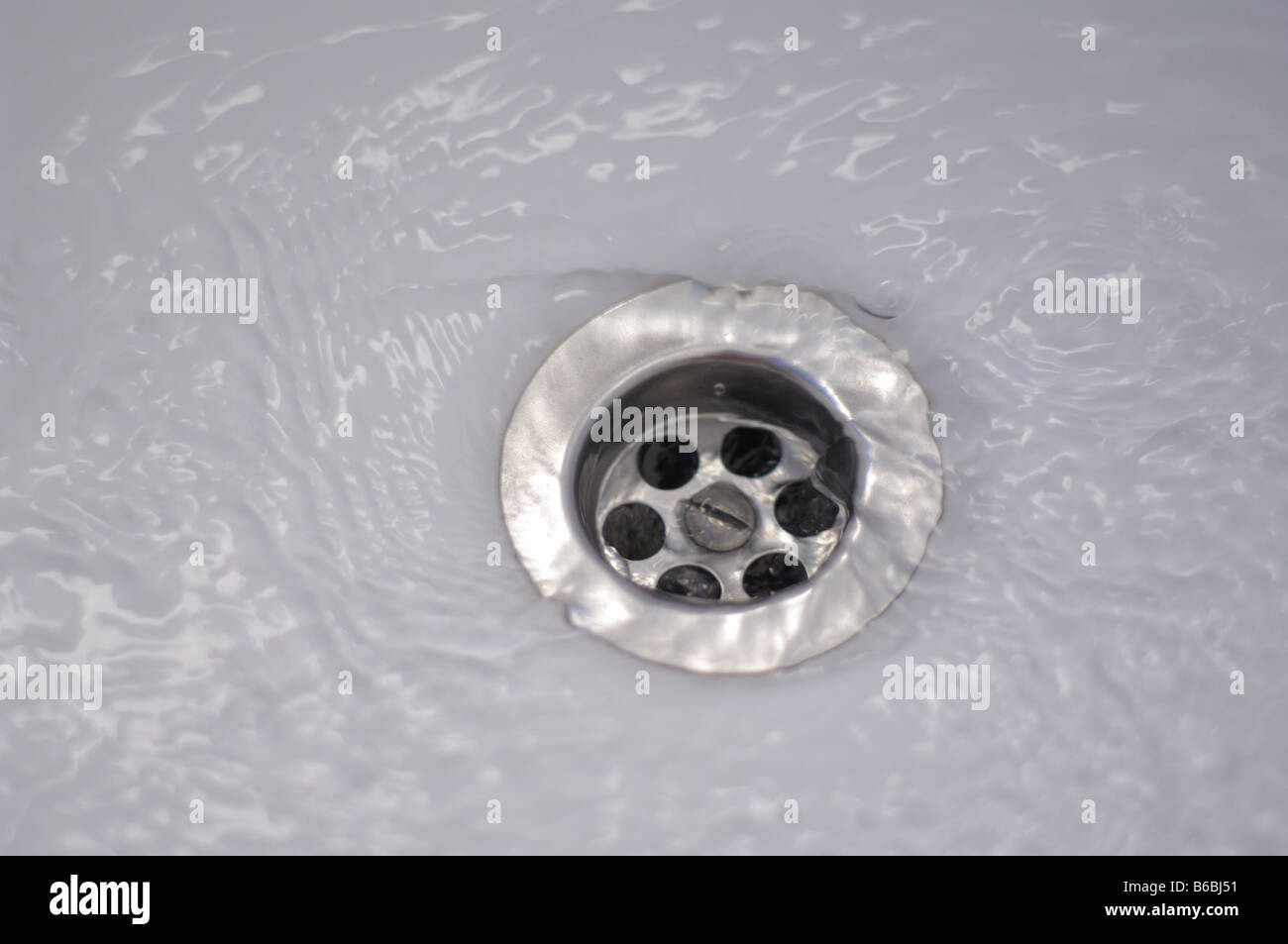 water running through a drain Stock Photo - Alamy