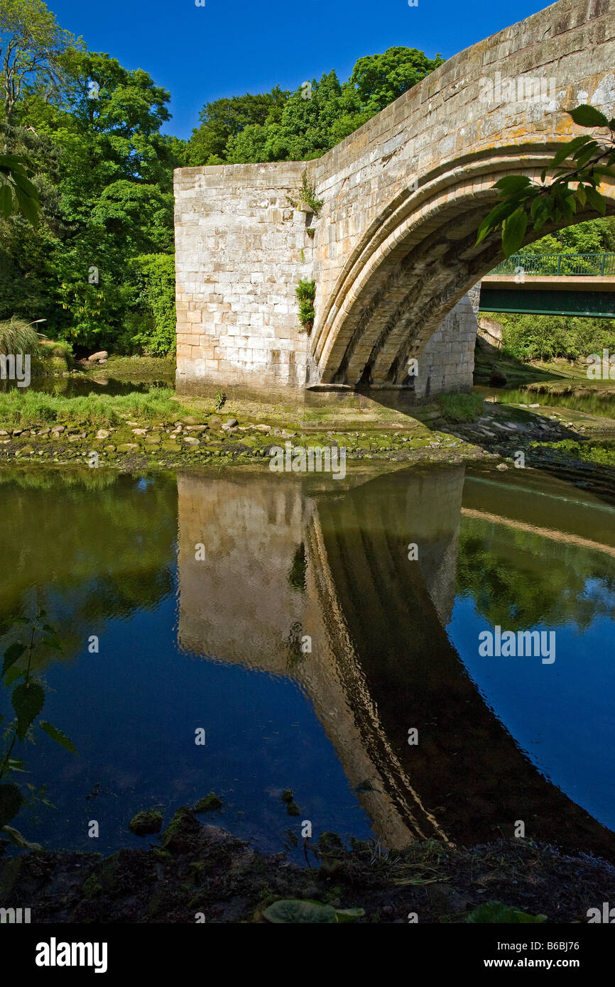 Medieval bridge on leaving the north side of Warkworth, Northumbria ...