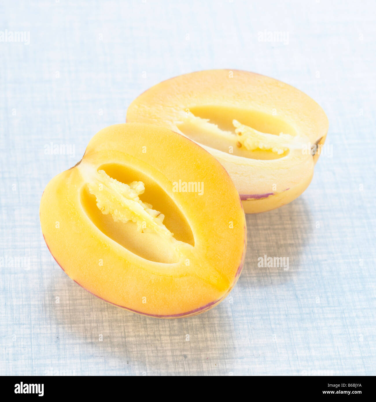 Close-up of halved pear melons Stock Photo - Alamy