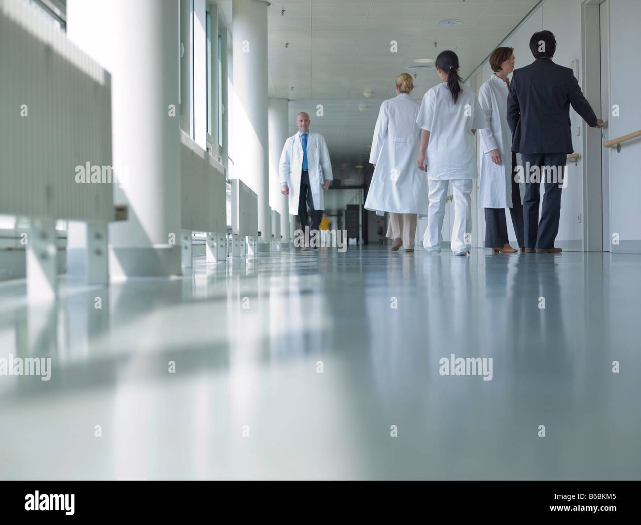 Doctors walking in corridor of hospital Stock Photo - Alamy