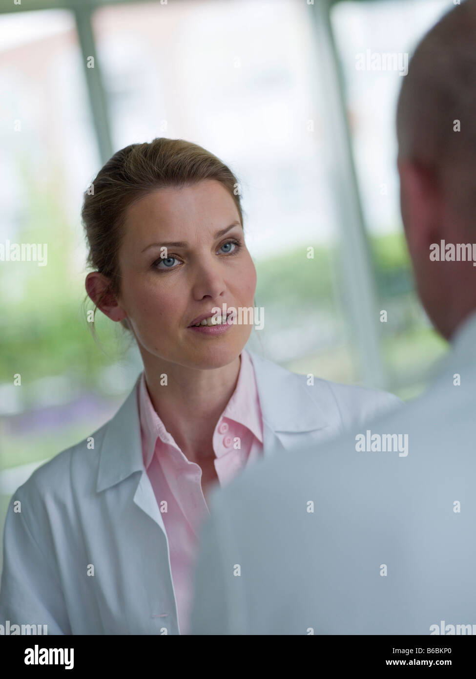 Two doctors discussing Stock Photo - Alamy