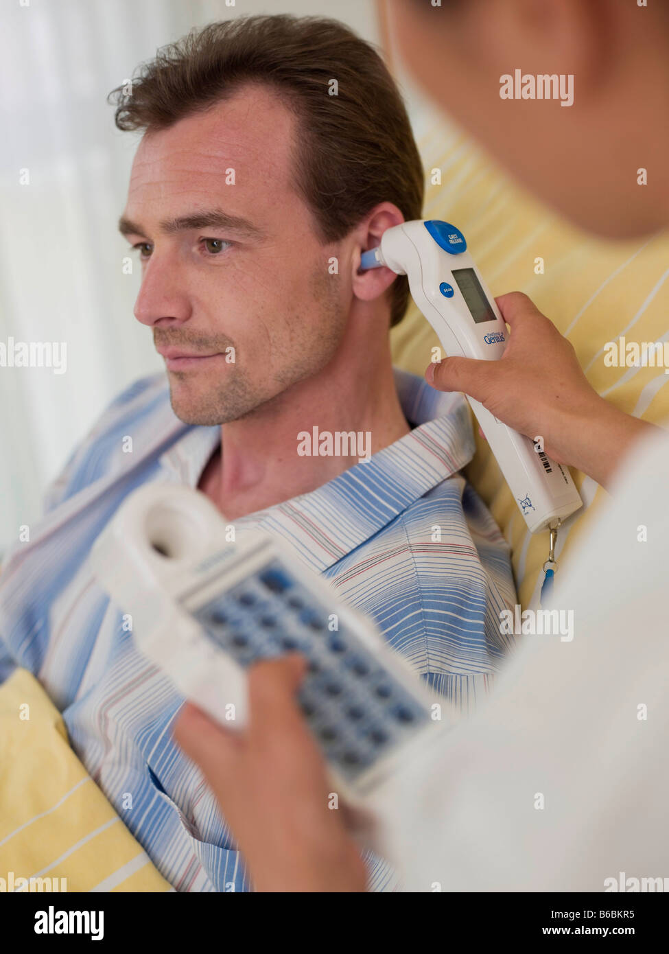 Doctor thermometer ear numbers hi-res stock photography and images - Alamy
