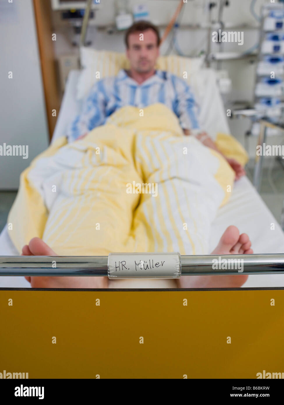 Man lying in hospital bed Stock Photo - Alamy