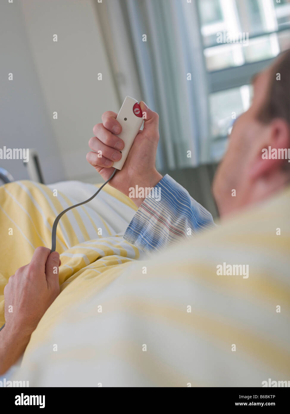 Patient pressing emergency call equipment Stock Photo - Alamy