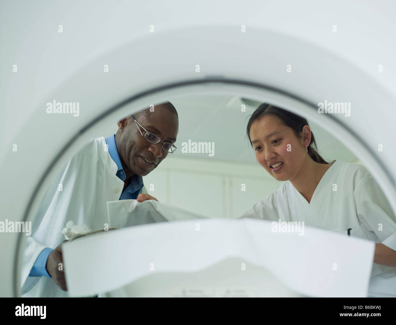Doctors checking patient before MRI scan Stock Photo - Alamy