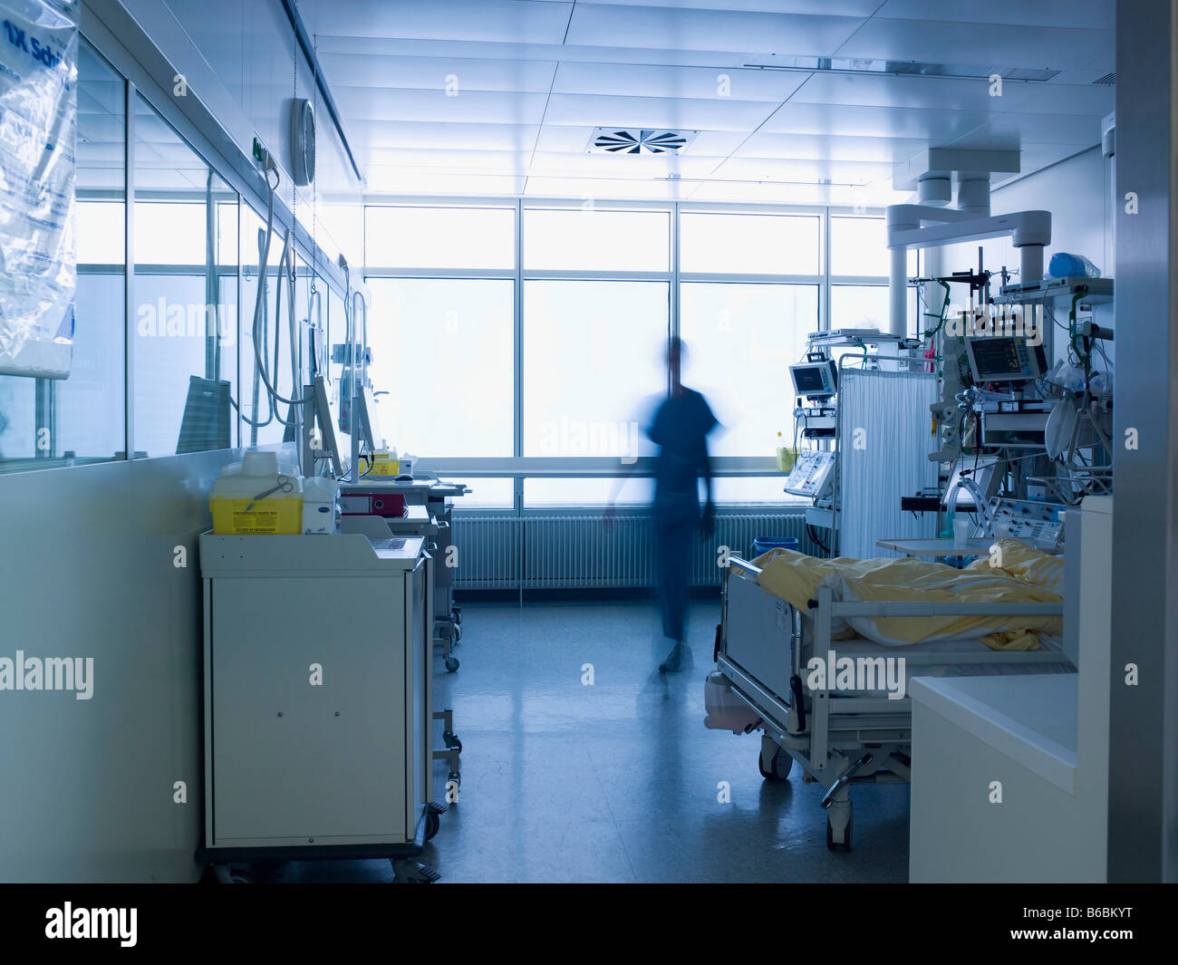 Blurred view of doctor walking in hospital ward Stock Photo - Alamy
