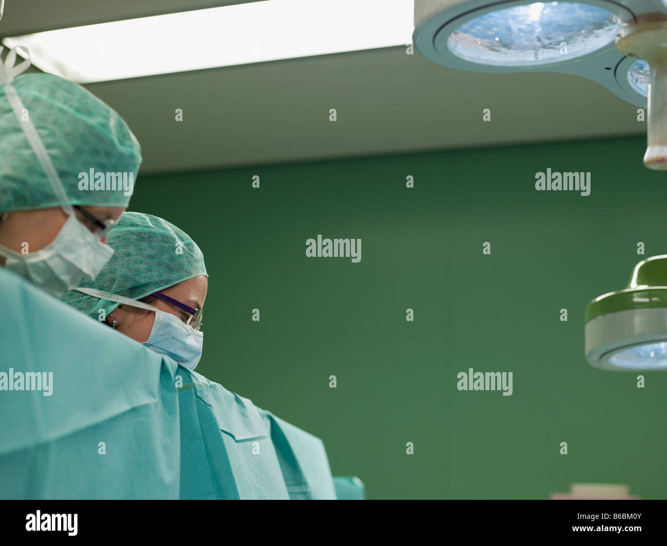 Surgeons in operating room Stock Photo - Alamy