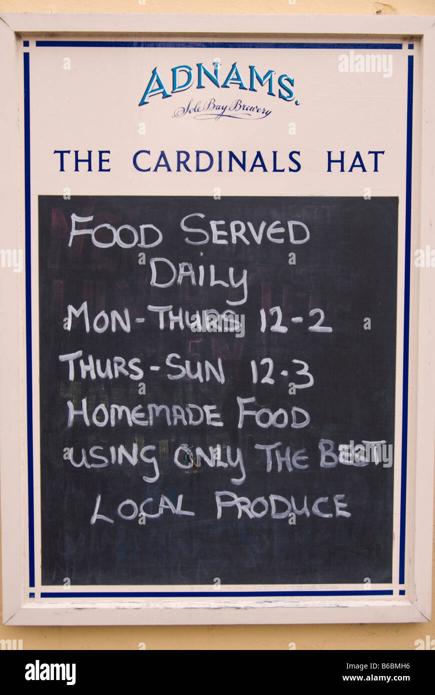 Food served daily sign outside uk pub Stock Photo - Alamy