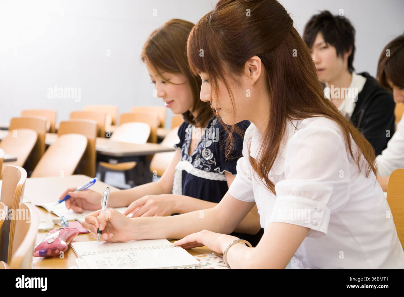 College students studying in lecture room Stock Photo - Alamy