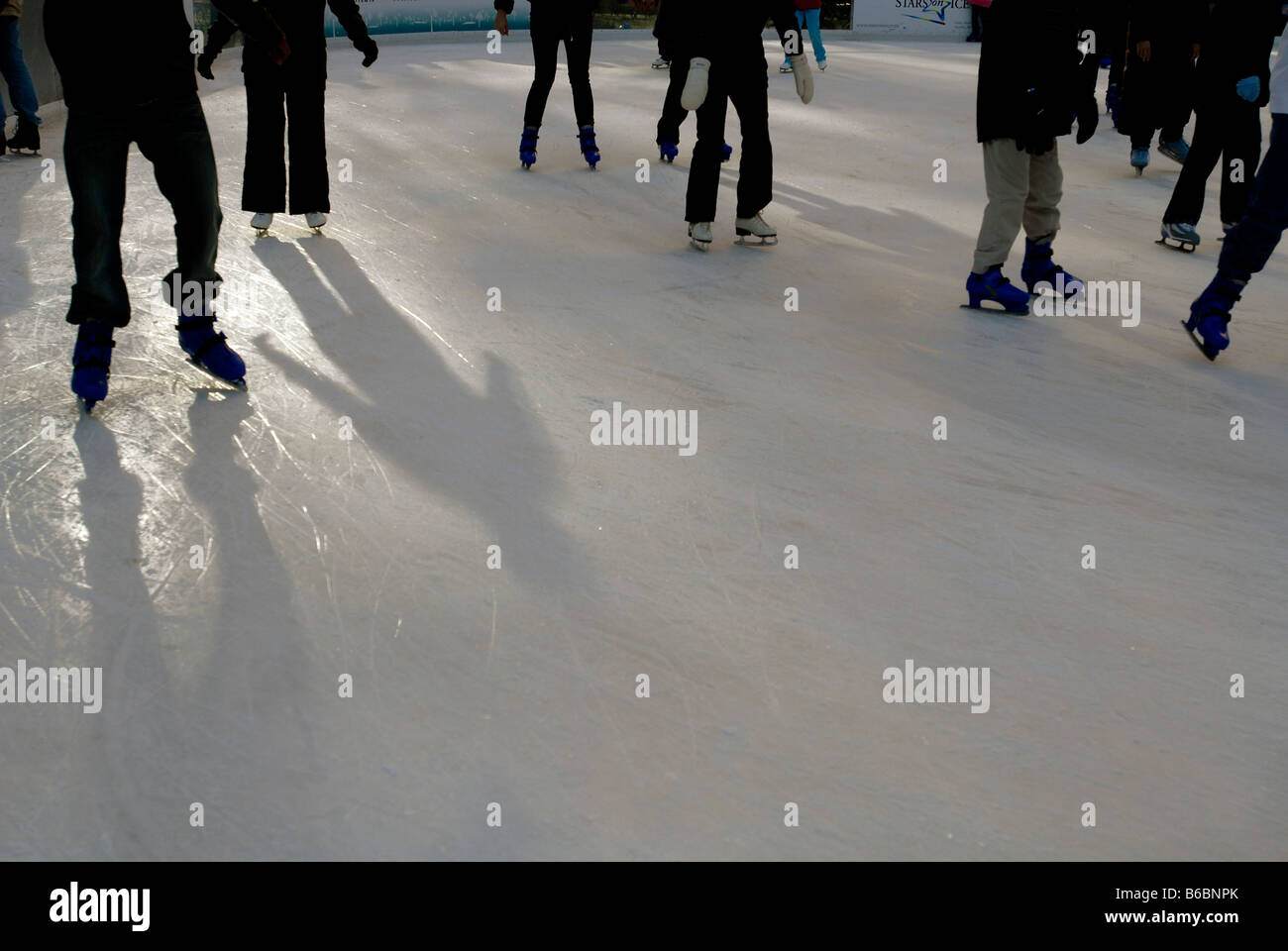 Skaters maneuver the packed Pond at Bryant Park ice skating rink in New ...