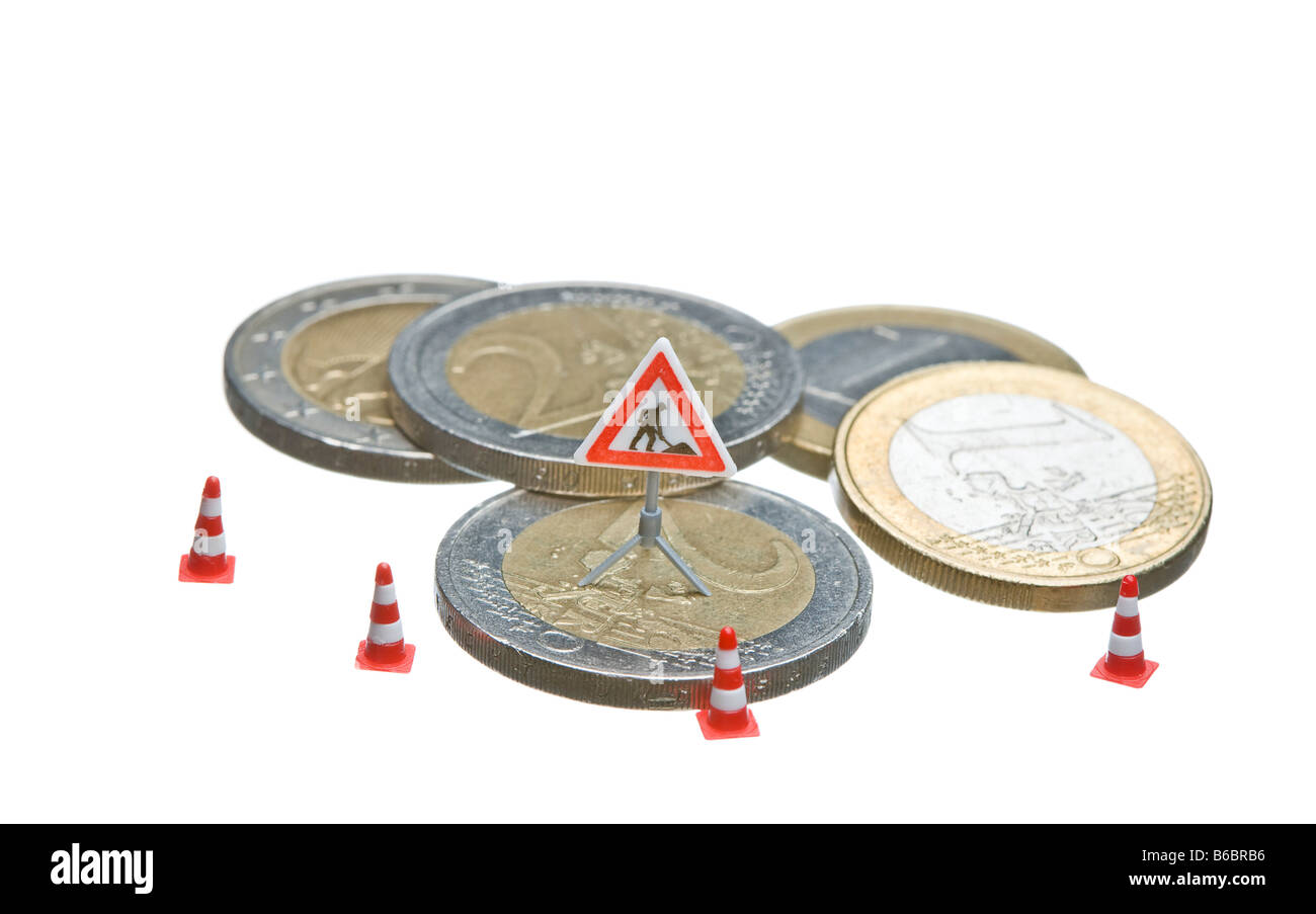 Miniature figures working on a heap of Euro coins. The objects are ...