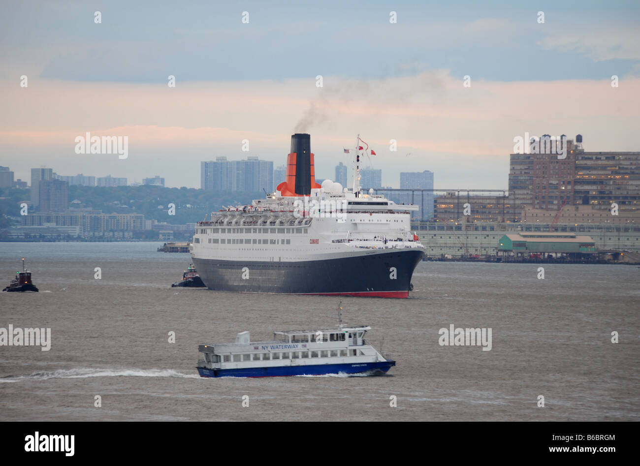 The QE2 sails out of New York Harbour for the last time, in a tandem ...