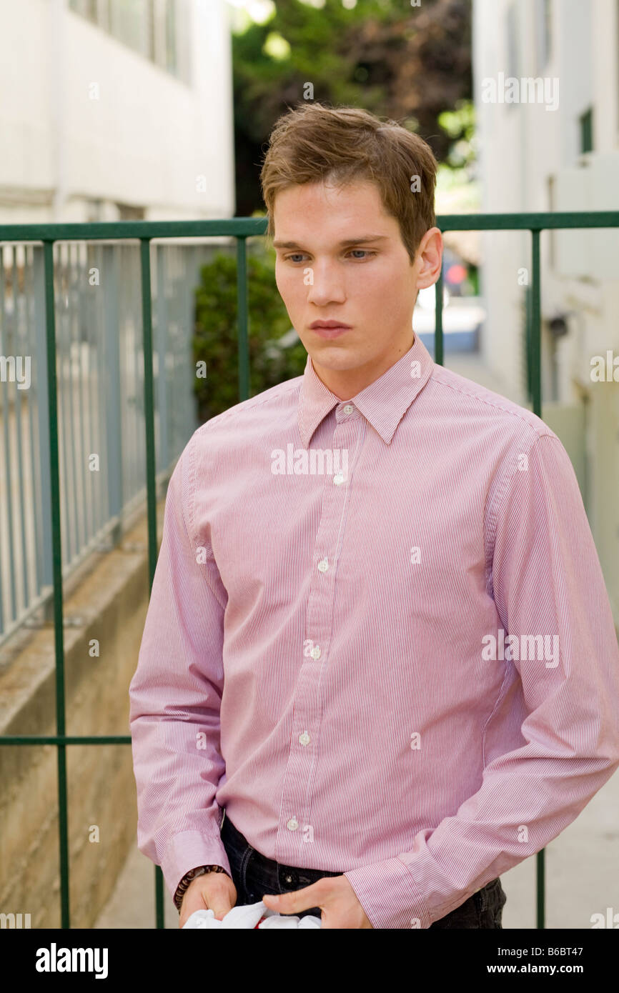 Scared young man looking down hi-res stock photography and images - Alamy