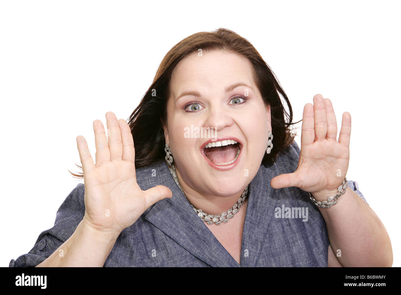 Beautiful plus sized model holding her hands up in a gesture of ...