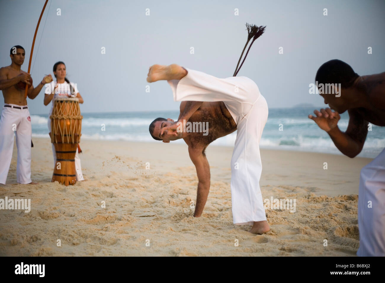 Capoeiristas practice Capoeira on Leblon beach in Rio de Janeiro Brazil ...