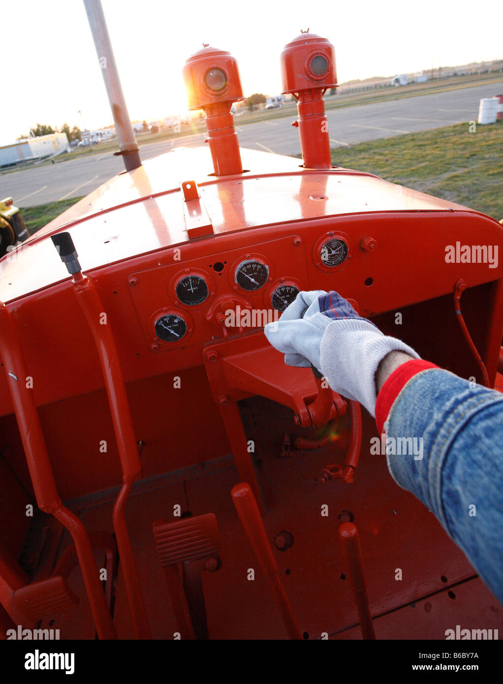 Hand operating controls in cab of earth mover Stock Photo - Alamy