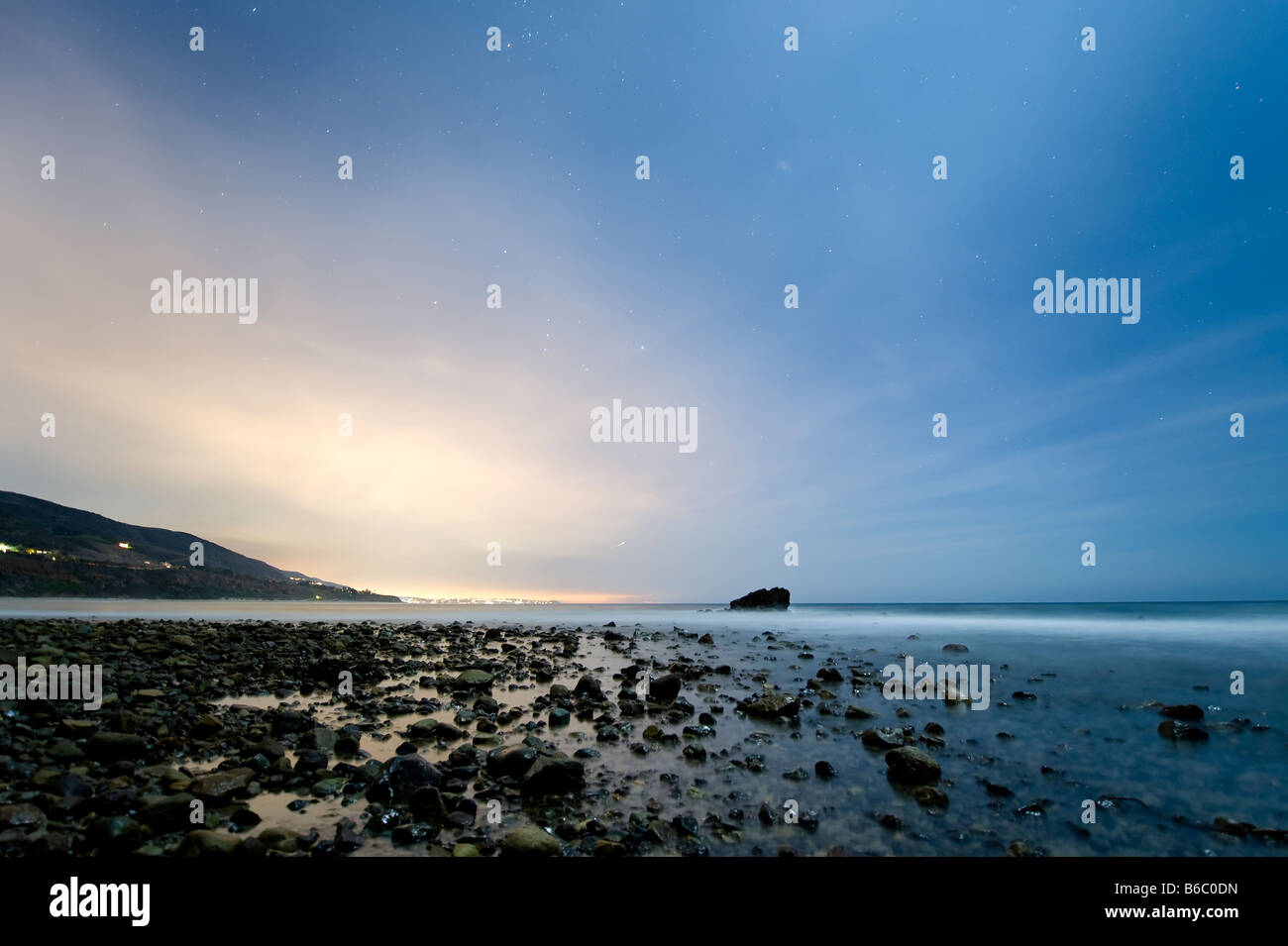 Beach at night with city lights from Malibu Stock Photo - Alamy