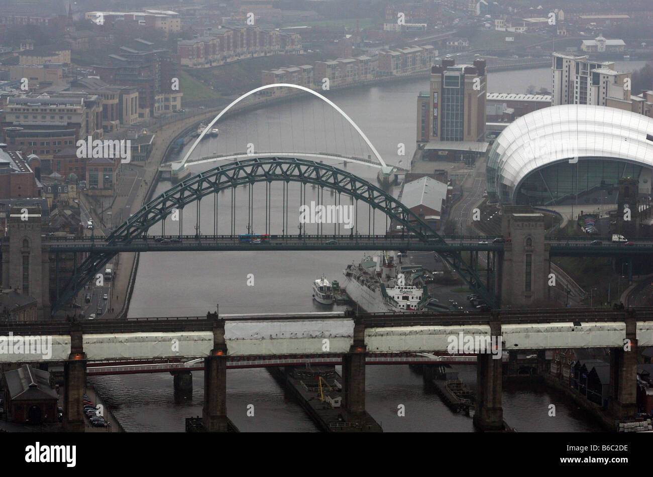 Aerial view of the Tyne Bridge and Gateshead Millennium Bridge crossing ...