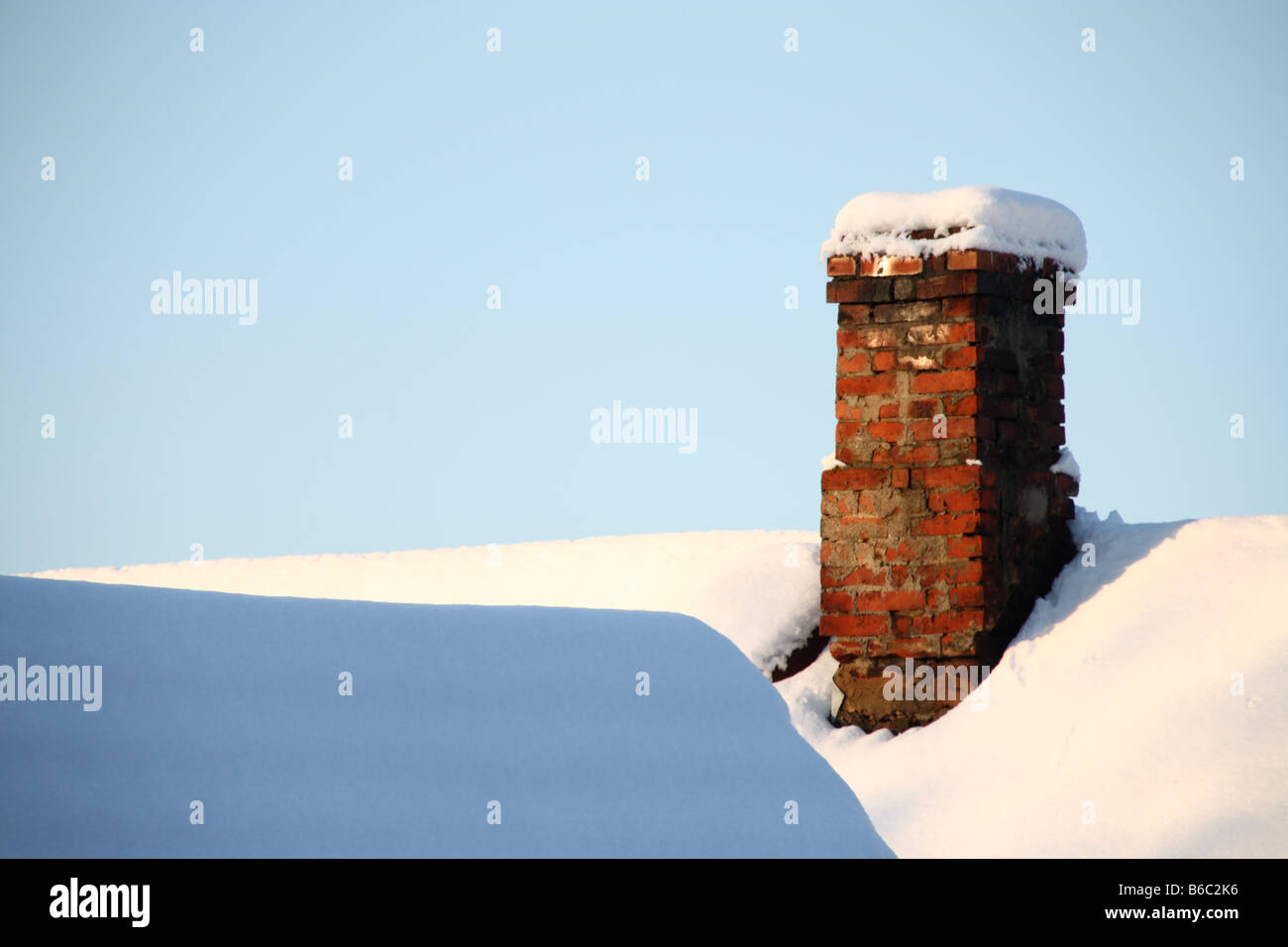 Chimney from red bricks on a snow covered roof Stock Photo - Alamy