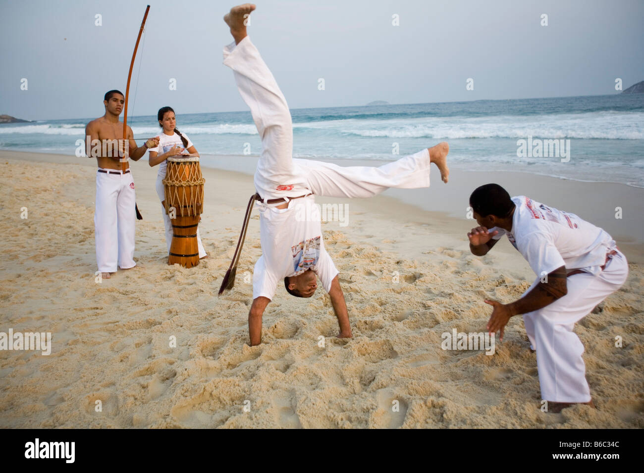 Capoeiristas practice Capoeira on Leblon beach in Rio de Janeiro Brazil ...