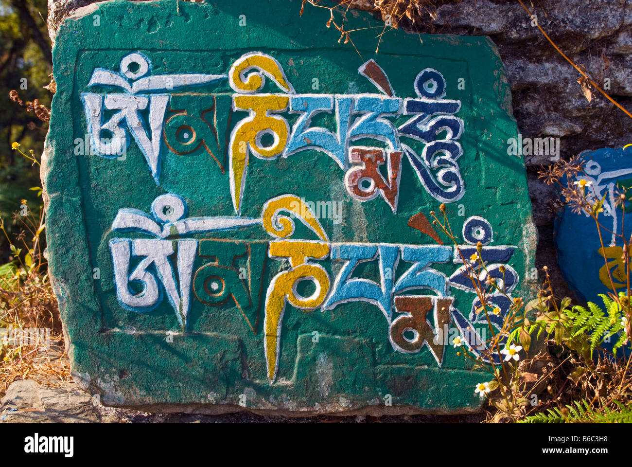 Prayer stone on a Mani Wall near Rinchenpong, Sikkim, India Stock Photo ...