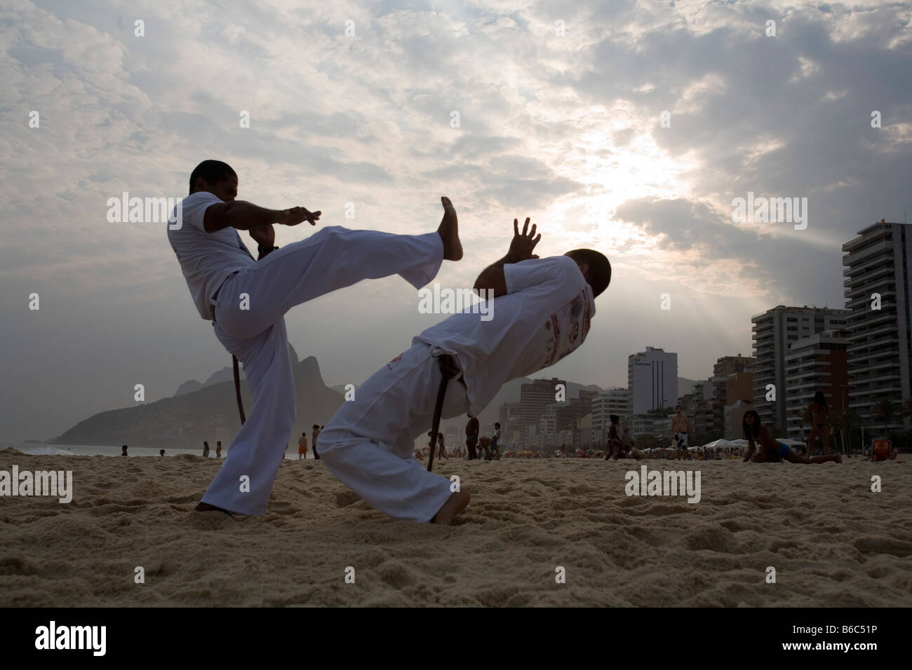 Capoeiristas practice Capoeira on Leblon beach in Rio de Janeiro Brazil ...