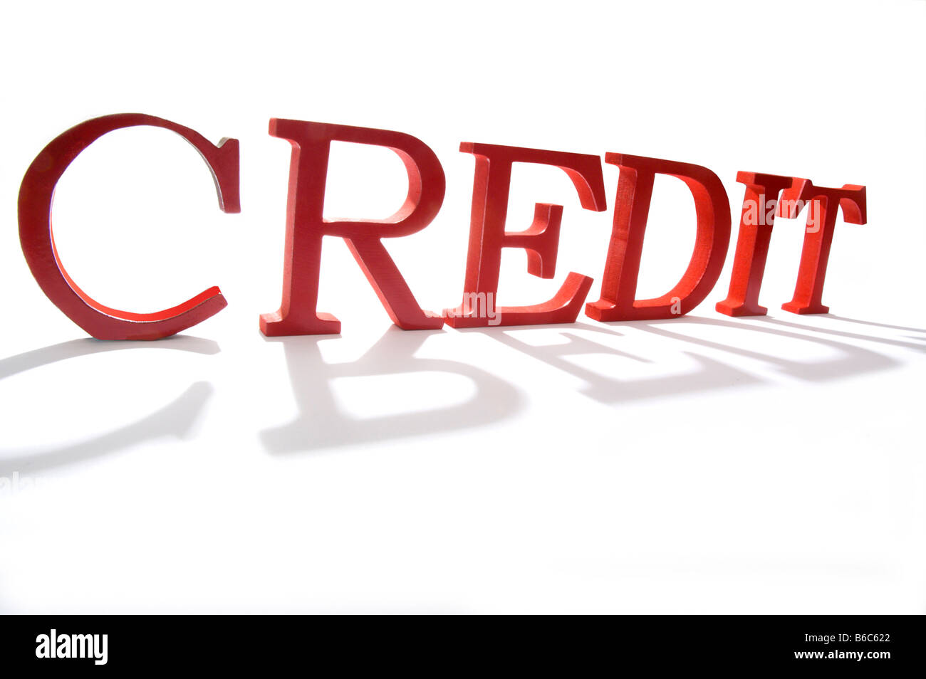 The word credit looming large in red Stock Photo - Alamy