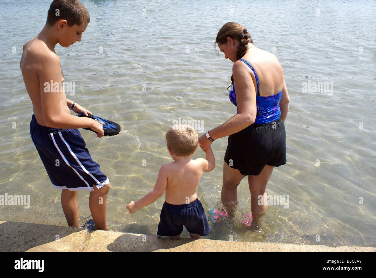 Cautious Stepping Into Water Stock Photo - Alamy