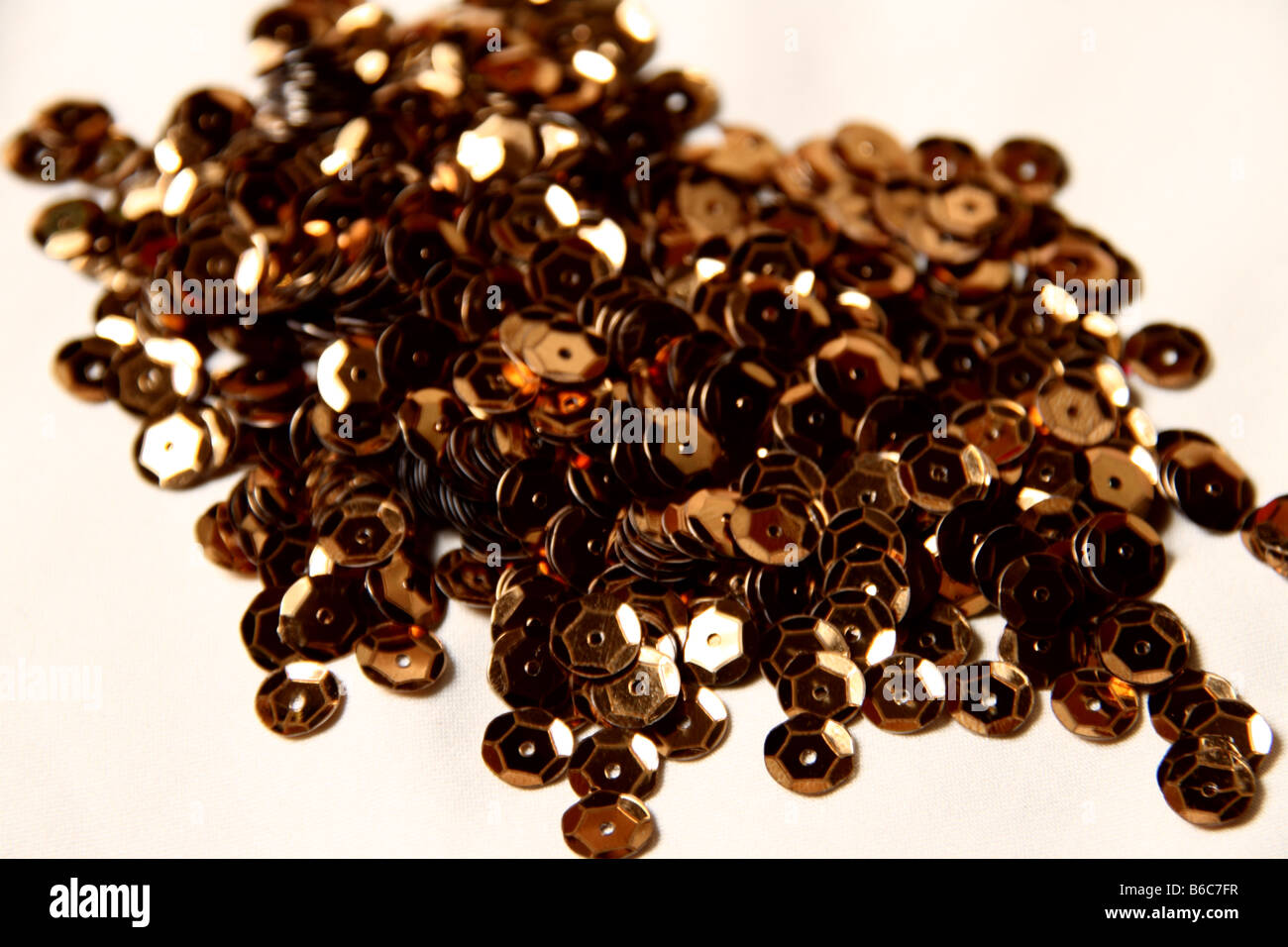 A heap of brown sequins Stock Photo - Alamy