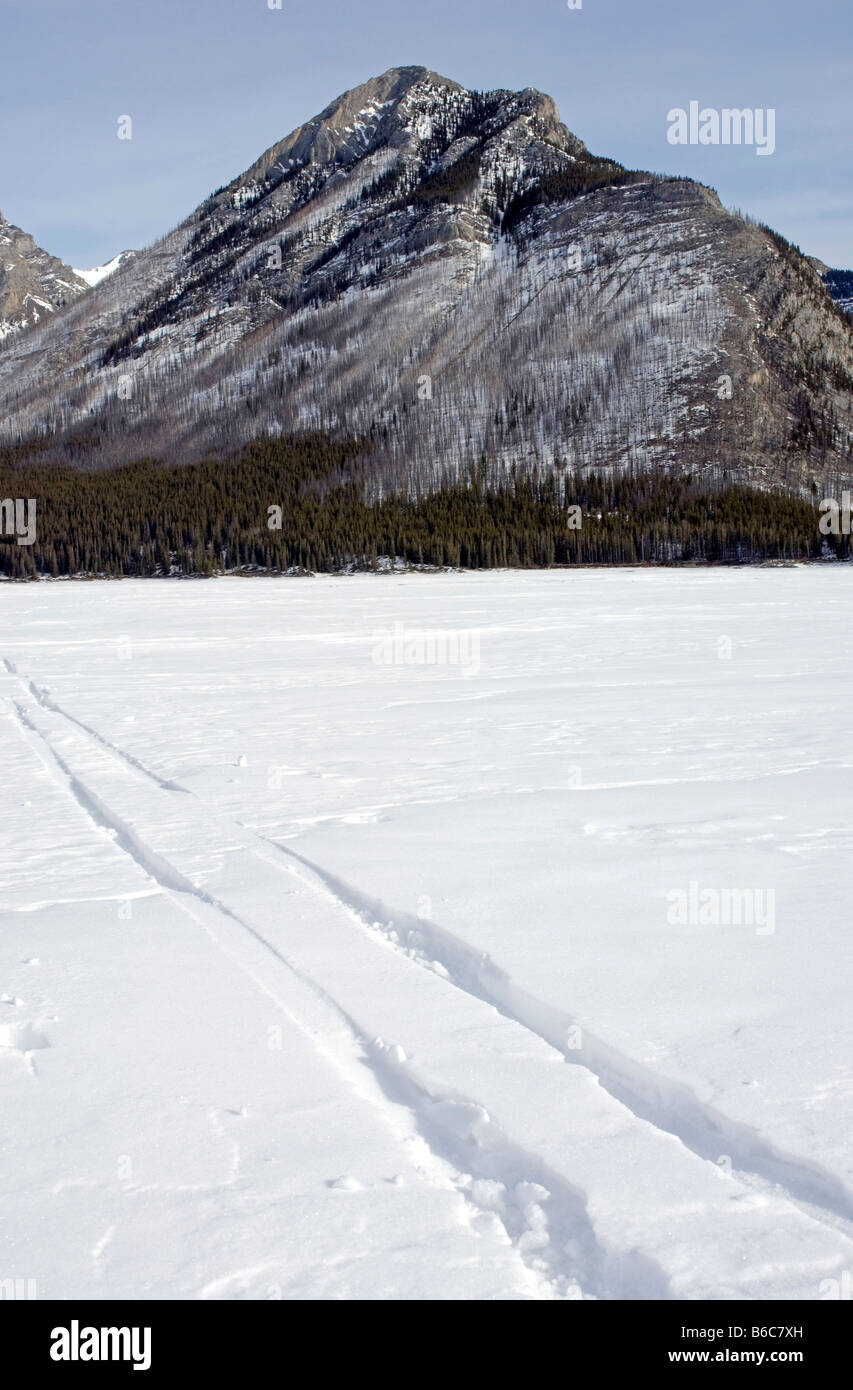Alpine ski tracks on frozen lake, Banff National Park, Banff Alberta ...