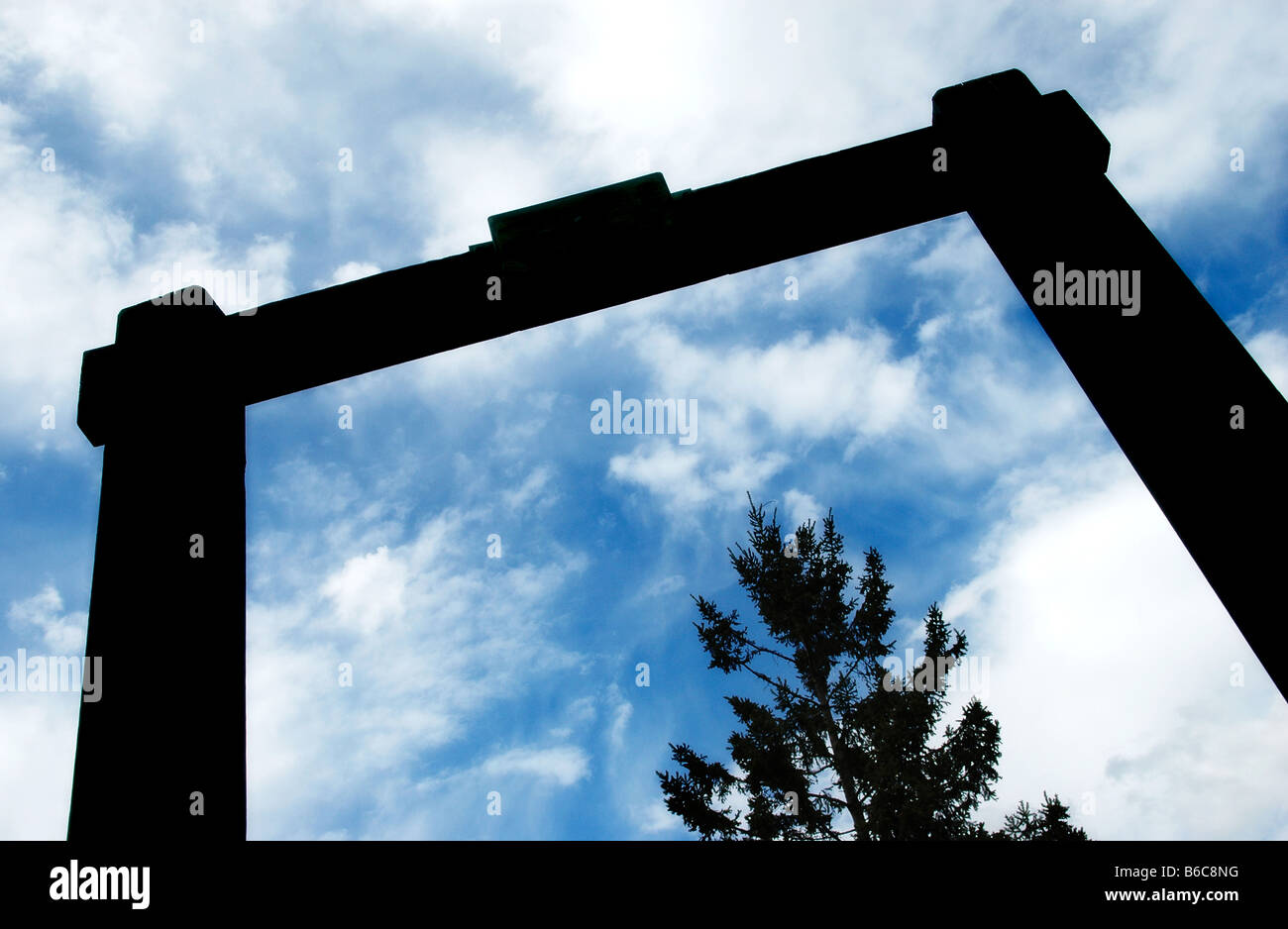 Wooden beams forming an arch with blue sky background Stock Photo - Alamy