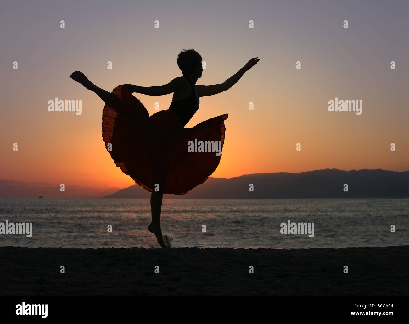Silhouette of woman dancing at sunset hi-res stock photography and ...