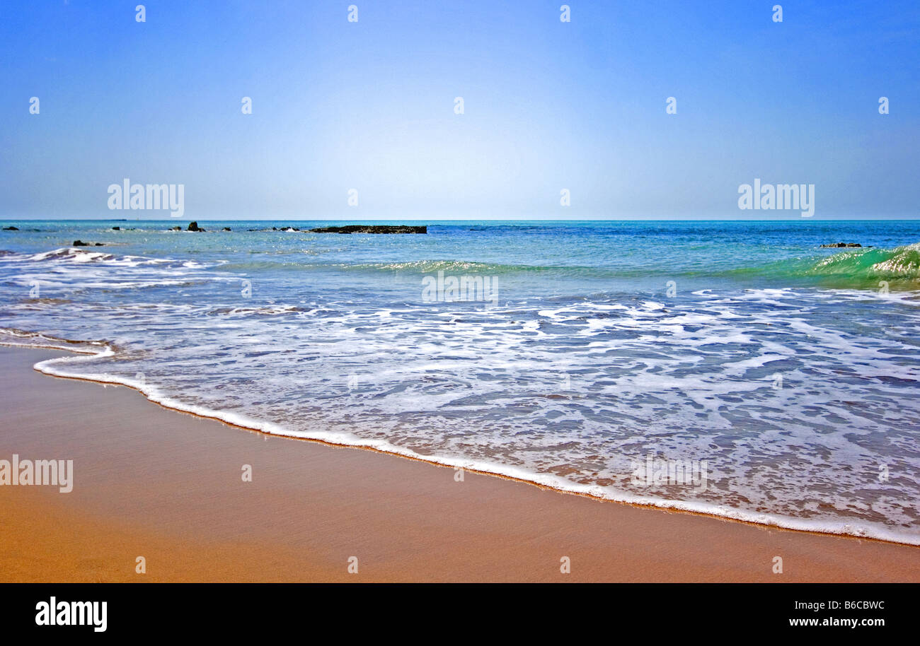 Surf breaking on the beach Stock Photo - Alamy