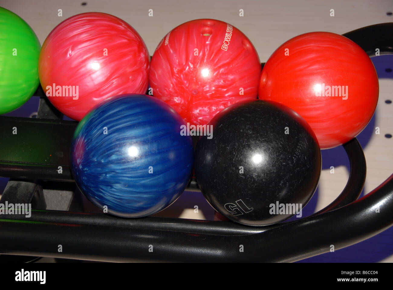 Row of bowling balls waiting their turn Stock Photo - Alamy