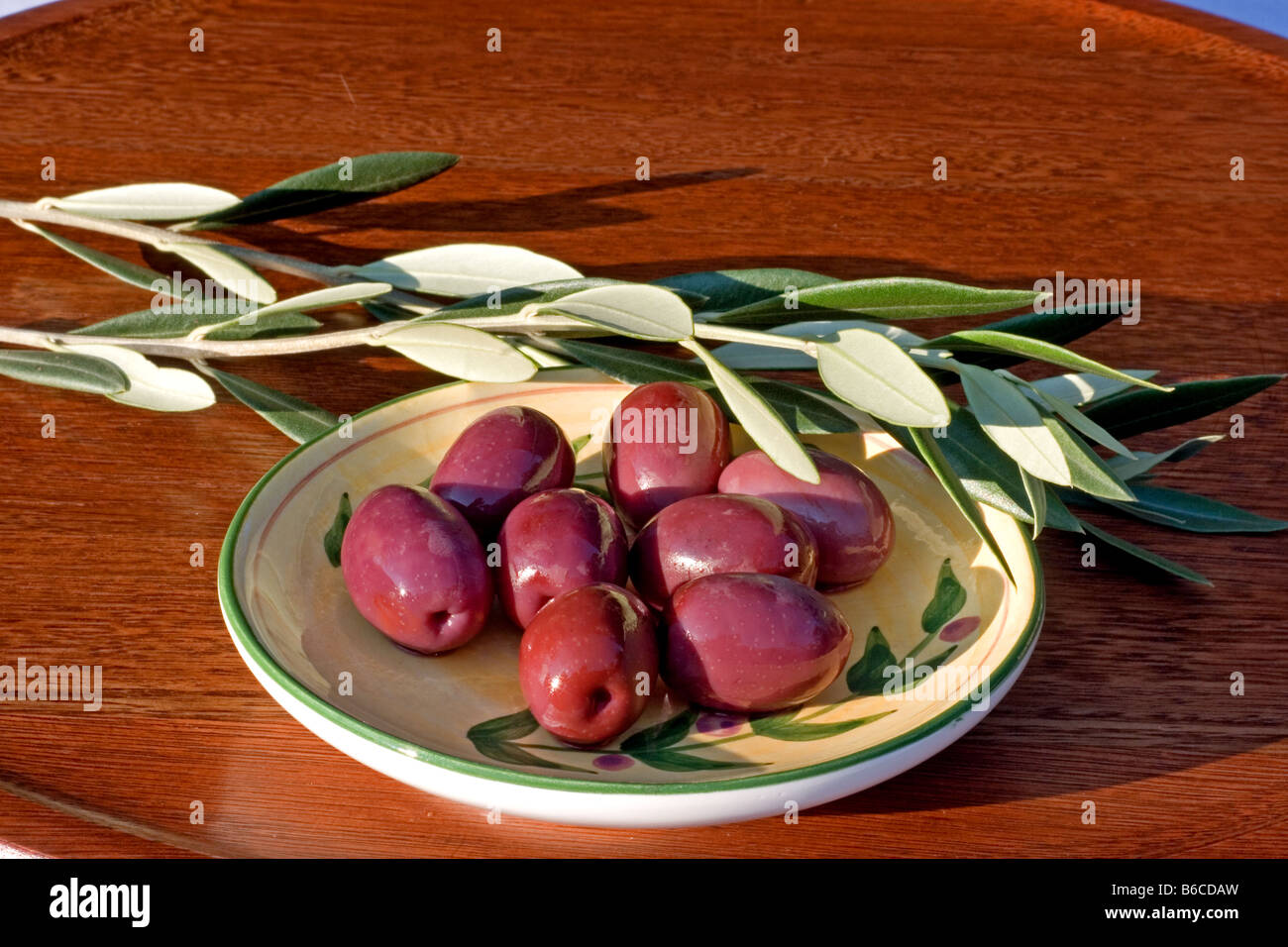 Red olives and leaves Stock Photo - Alamy